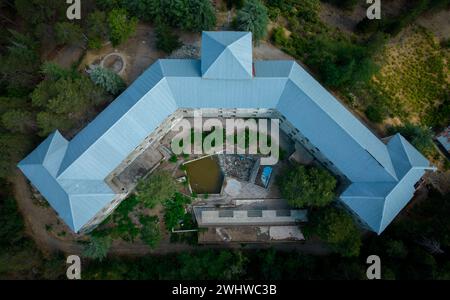 Drone aerial of an abandoned hotel building in the forest. Deserted places outdoor Stock Photo ...