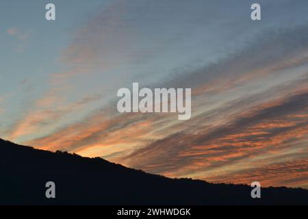 Beautigul view of strange red sunset striped and unnaturally directed ...