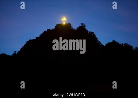 Illuminated cross on the Pinnerkreuz viewing peak in the evening ...
