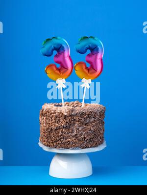 Multicolored balloon for number 33 celebration. Happy birthday on white ...