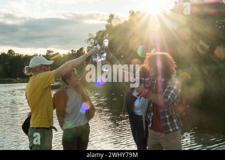 Cheers. Healthy millennial multiracial group of friends cheering with ...