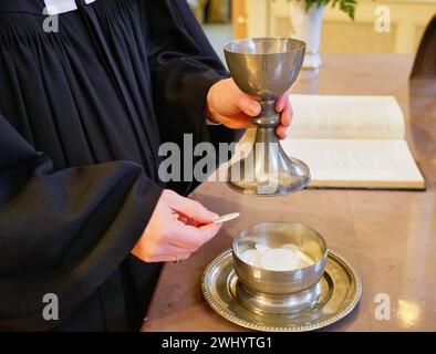 Pastor at communion Stock Photo - Alamy