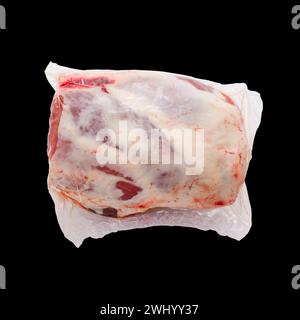 Frozen Lamb leg in package isolated on black, top view Stock Photo - Alamy