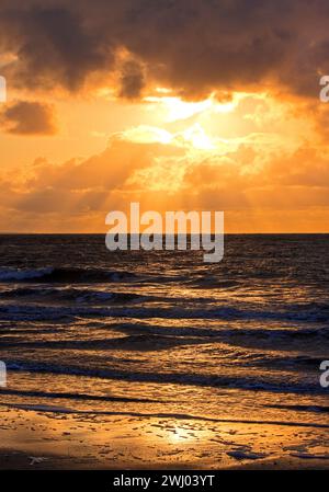 Flood fringe in the mudflats with setting sun, North Sea, Norderney ...