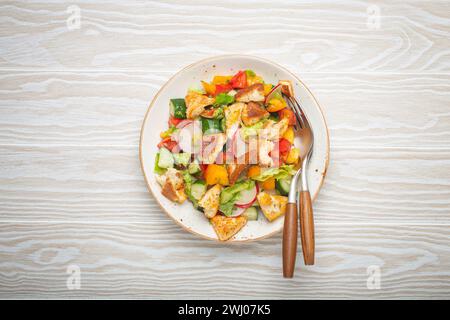 Traditional Levant dish Fattoush salad, Arab cuisine, with pita bread ...