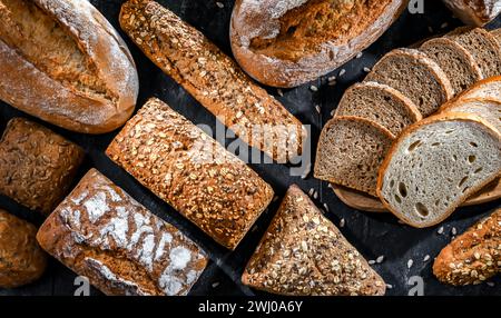 Assorted bakery products including loafs of bread and rolls Stock Photo ...
