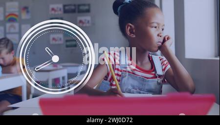 Image of clock over bored african american schoolgirl at desk in class ...