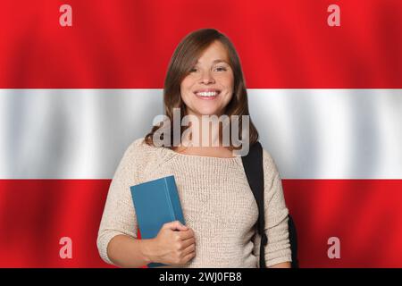 Happy woman student against Austrian flag background. Travel, education ...