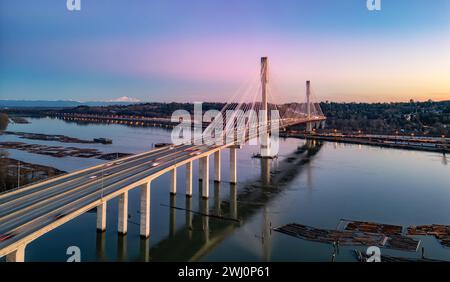 Port Mann Bridge across the Fraser River at sunset in Vancouver, BC ...