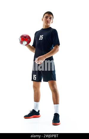 Dynamic image of young man, handball player in motion with ball against ...