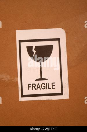 Fragile sticker on a cardboard box Stock Photo - Alamy