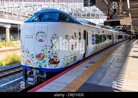 Hello Kitty, in a Japan Rail train conductor uniform, aboard the ...