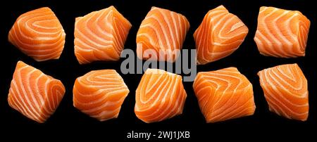 Salmon cubes isolated on black background Stock Photo - Alamy