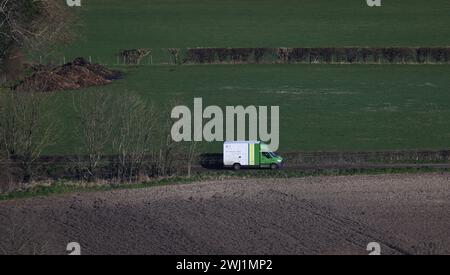 A Waitrose Supermarket home delivery van delivering goods in the ...