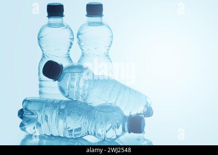 Blue bottles of pure still water against white background Stock Photo ...