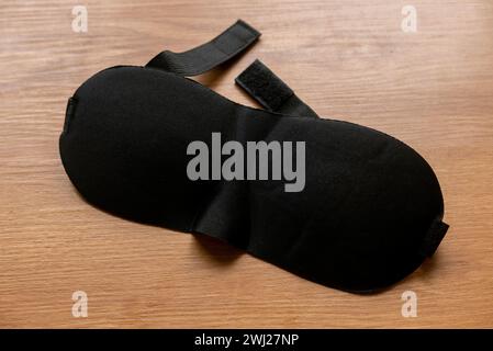 Sleeping Mask on Wooden Background Stock Photo - Alamy