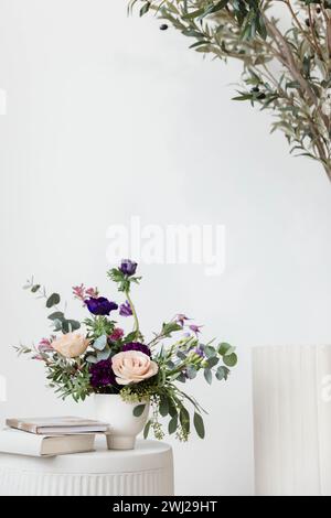 Muted Purple Floral Arrangement in Minimal Home Setting Stock Photo - Alamy