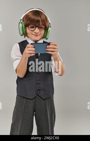 Kid Listening music. Carefree boy in headphones. Child in earphones ...