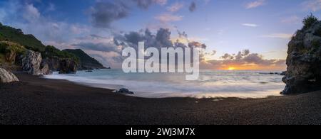 A panorama view of the Marina di Maratea beach at sunset Stock Photo ...