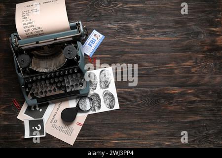 Retro typewriter, criminal files and document of FBI agent on dark ...