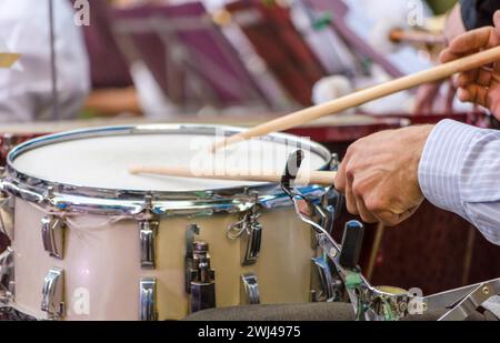 Male musician drummer hands with drumsticks and drum close up Stock ...