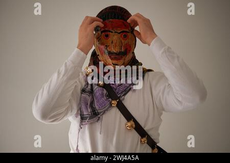 A young "mamuxarro" dressed in a brass "katola", twelve bells ...