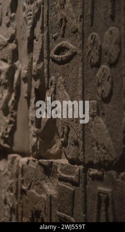 The ancient Egyptian hieroglyphs carved onto a stone structure from ...