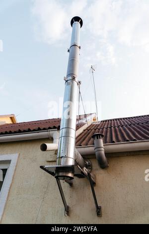 Metal structure of a bathhouse chimney Stock Photo - Alamy