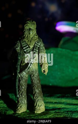 Chewbacca figure placed on a rocky planet with the Millennium Falcon in ...
