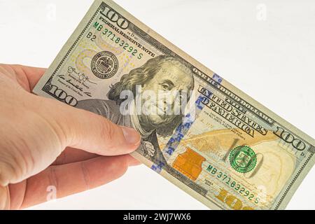 Authentication of banknote 100 dollars for clearance. Watermarks on a ...