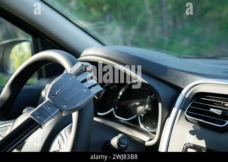 Robot arm on a steering wheel. Artificial intelligence drives a car ...
