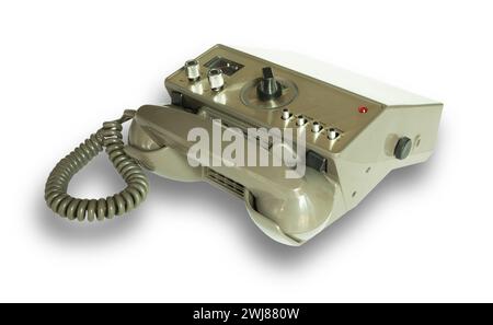 Old two-way radio with a coiled cord and receiver like an old telephone ...
