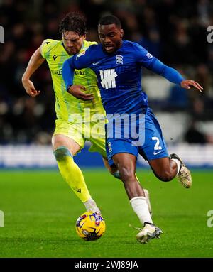 Birmingham City's Ethan Laird (left) and Mansfield Town's Caylan ...