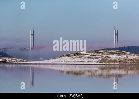 Fog under bridge between town Stenungsund and island Tjörn on Swedens ...