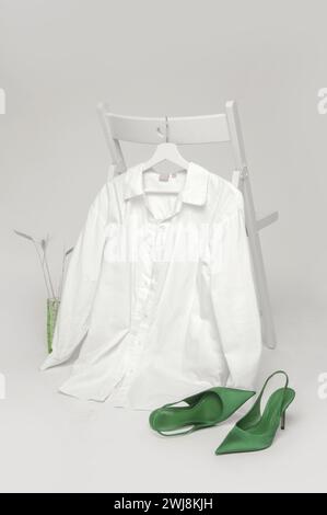 Clothes on a chair. Product photography, fashion still life. Spring ...