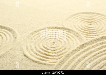 Zen rock garden. Circle patterns on white sand, top view Stock Photo ...
