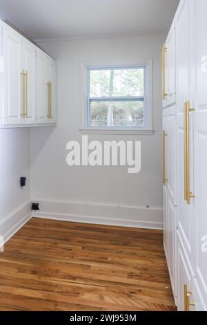 Wooden shaker style cabinets and modern appliances in kitchen with ...