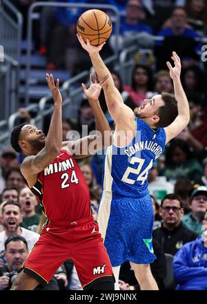 Miami Heat forward Haywood Highsmith, front left, looks to pass the ...