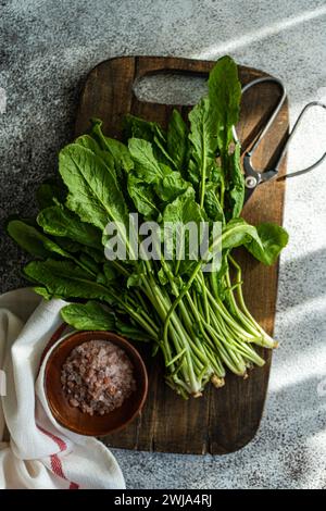Bunch of fresh arugula on textured background. Branches of organic ...