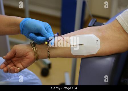 Nurse Inserting a Cannula into Patient Ready to Administer Ferinject ...