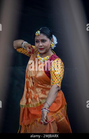 Dhaka. 14th Feb, 2024. A woman poses for photos during the celebration ...