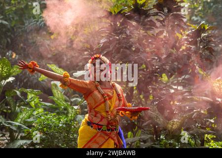 Dhaka. 14th Feb, 2024. A woman poses for photos during the celebration ...