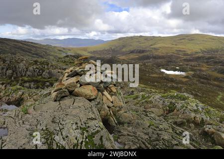The summit carin of Haystacks Fell, overlooking Buttermere, Cumbria ...