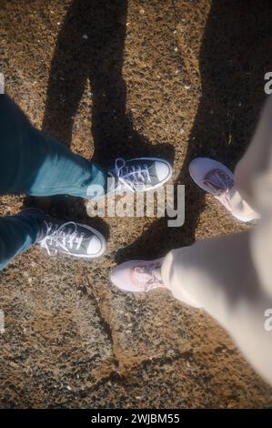 Unknown man in sneakers standing on floor indoors, close up Stock Photo ...