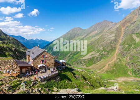 mountain hut Nürnberger Hütte, resting and relaxing hiker Stubaier ...