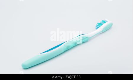 Manual modern tooth brush closeup on plain background Stock Photo - Alamy