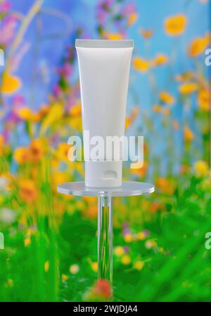 Blank white cosmetics tube and spring flowering tree branch with white ...