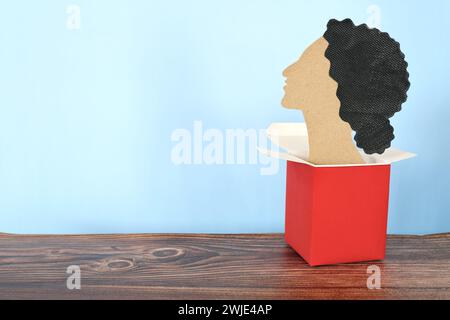Woman paper cutout coming outside of box. Women coming out, empowerment ...