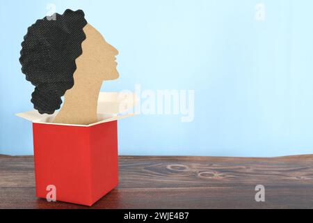 Woman paper cutout coming outside of box. Women coming out, empowerment ...