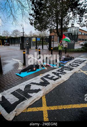 Protesters place themselves in a three-way lock-on, blocking the ...